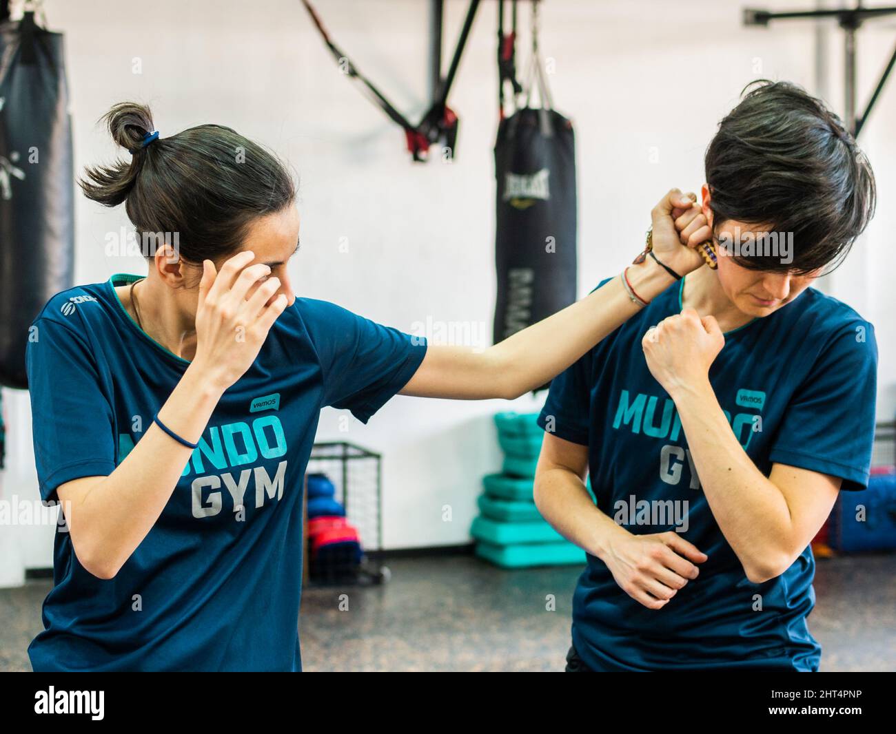 Females practicing self defense exercises in the gym Stock Photo - Alamy