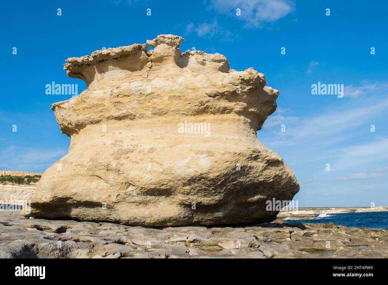 Large globigerina limestone boulder on wave-cut platform along the ...