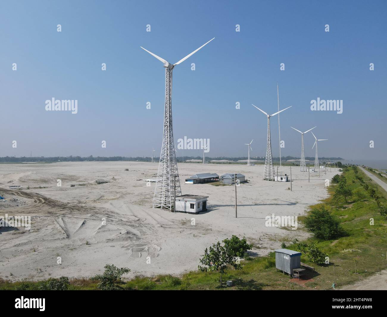 Landscape view of an industrial place with windmills Stock Photo - Alamy