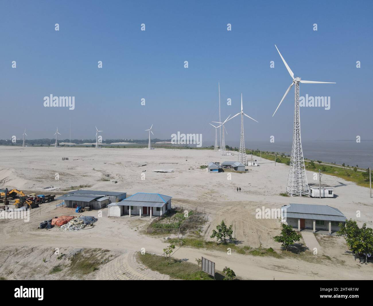 Landscape view of an industrial place with windmills Stock Photo - Alamy