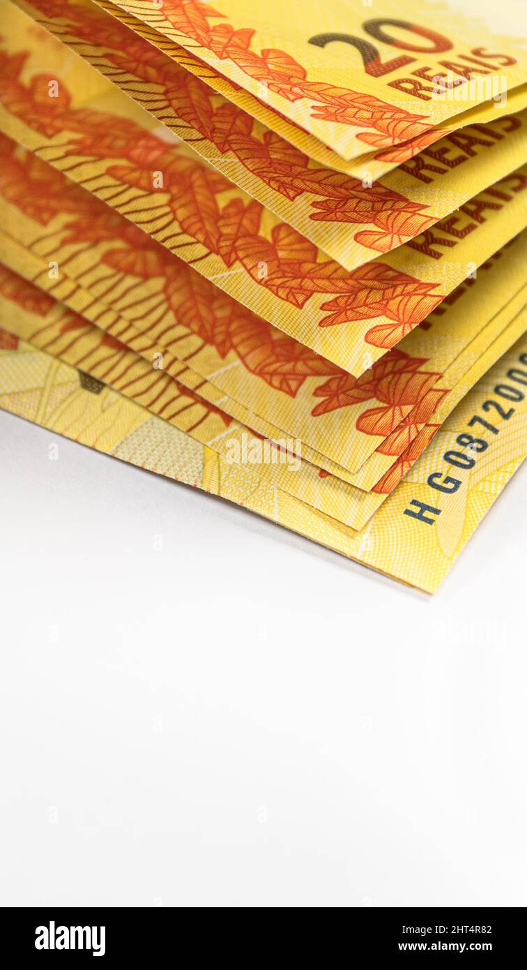 Vertical shot of 20 reais banknotes on white background Stock Photo - Alamy