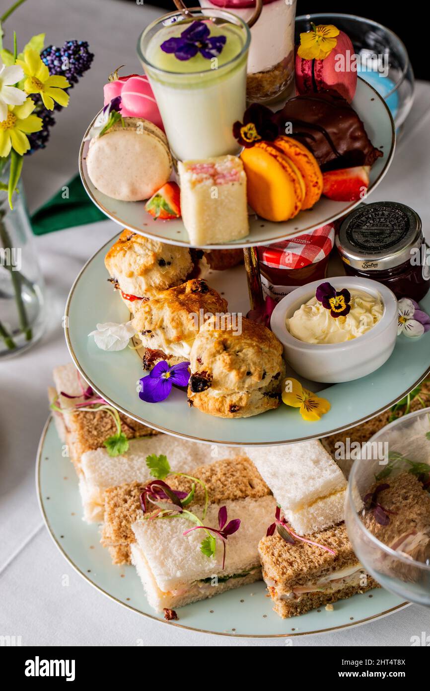 The festive table full of different appetizing desserts in the ...