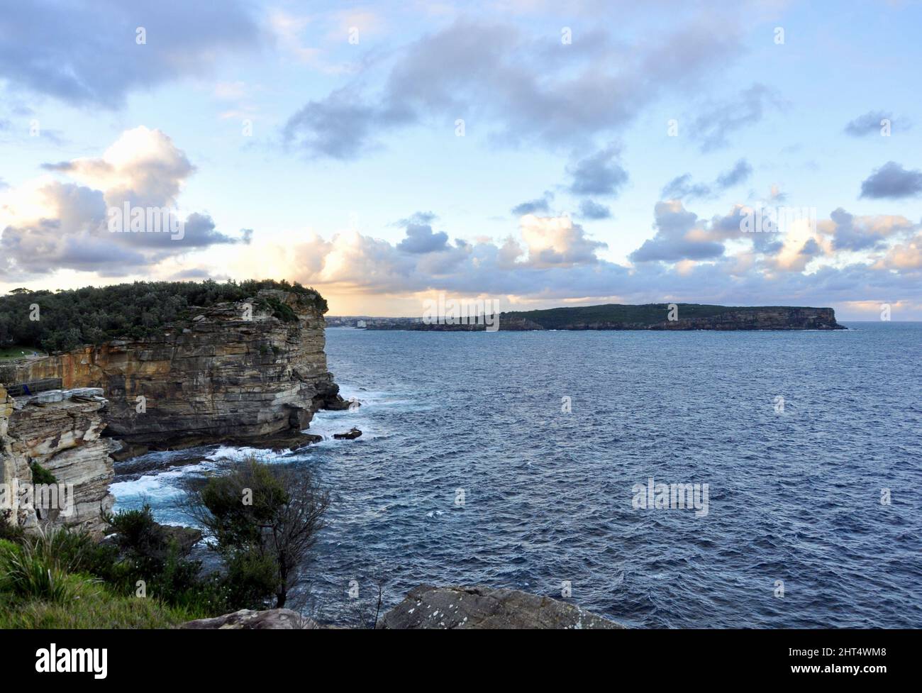 An aerial shot of sandstone cliffs and a sea in Sydney, New South Wales ...