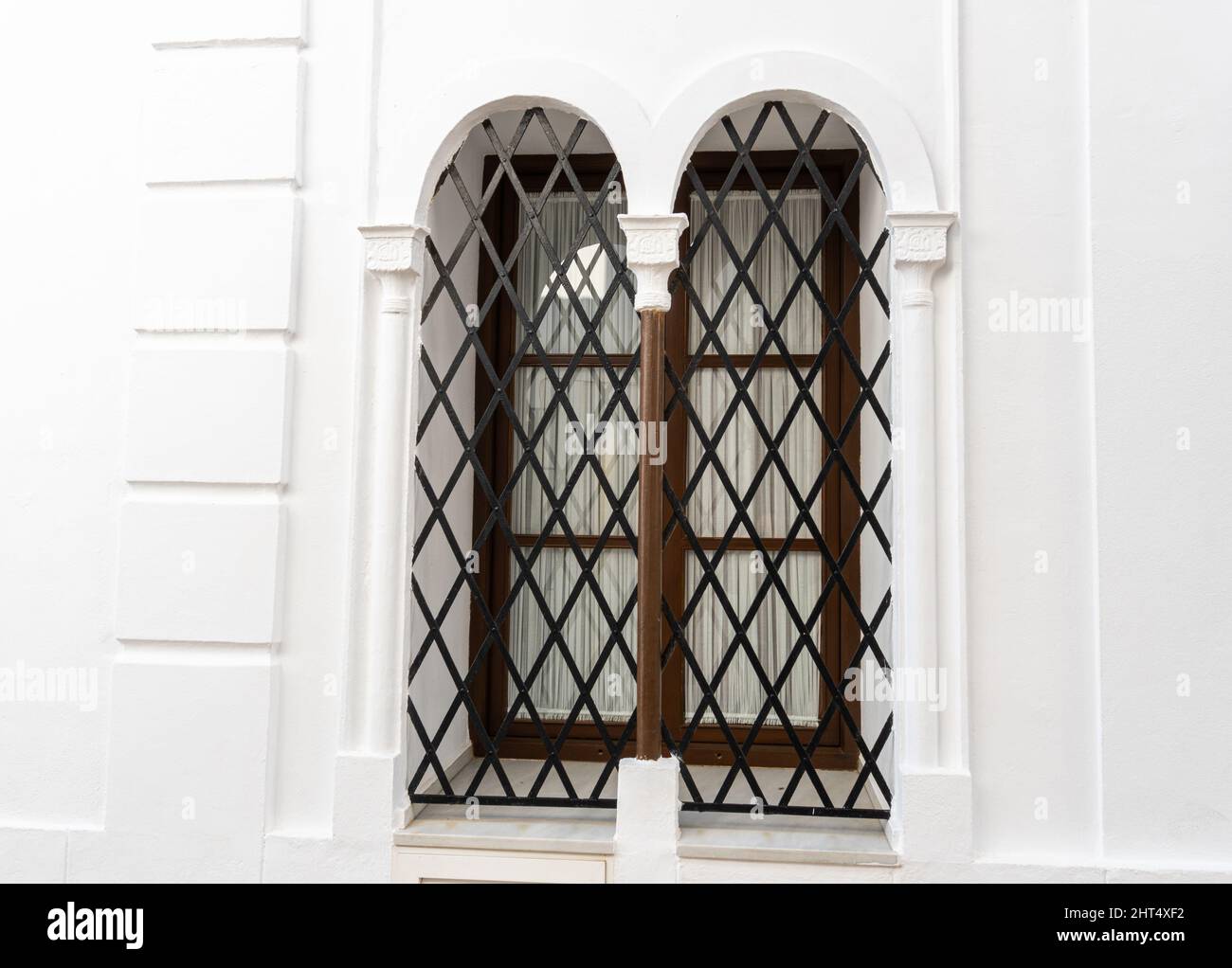 Arched window of a white building Stock Photo - Alamy