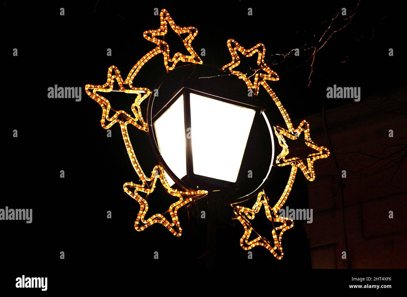Focused shot of led lights in star shapes over a street light column ...