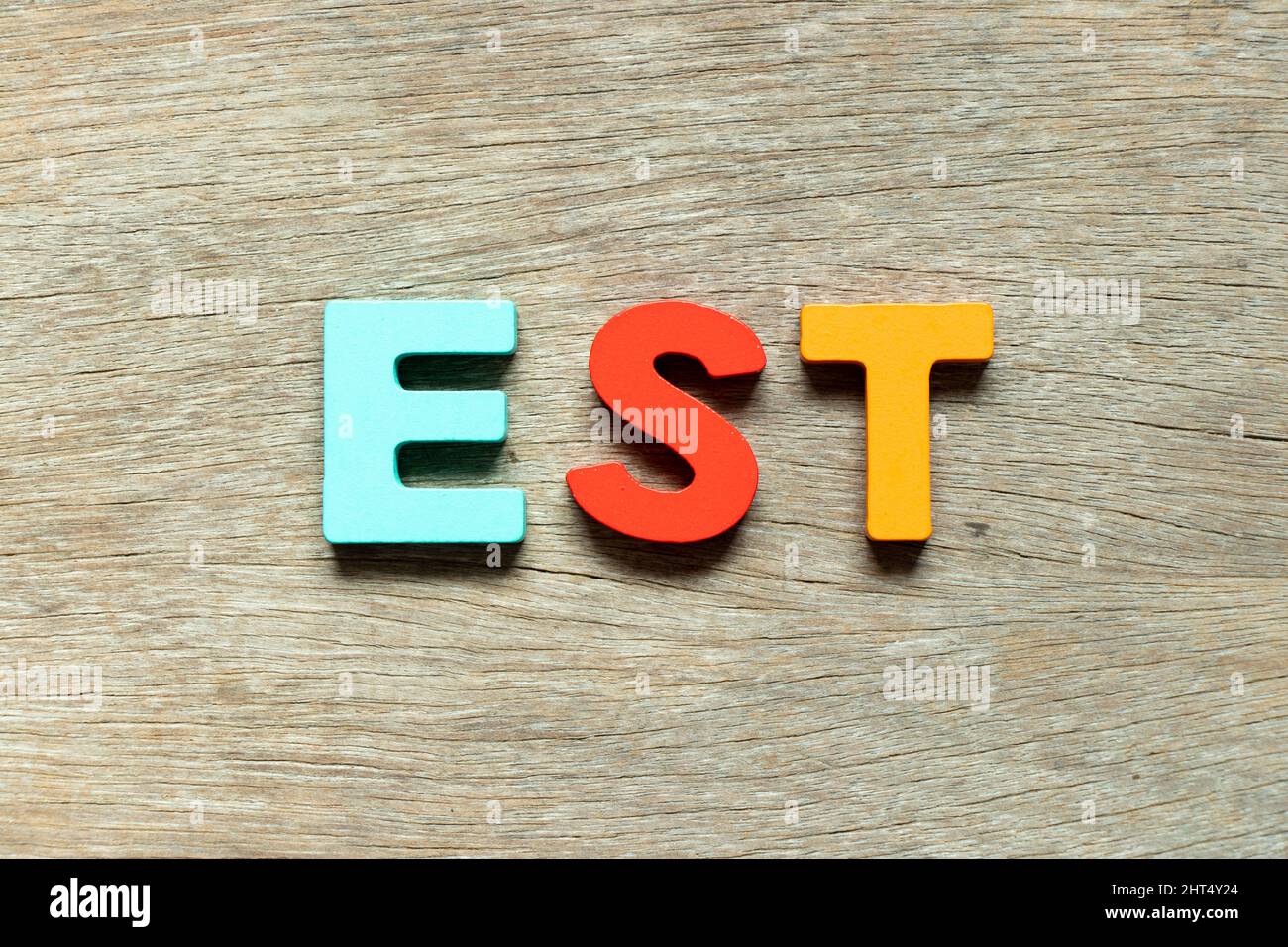 Color alphabet letter in word EST (abbreviation of established ...