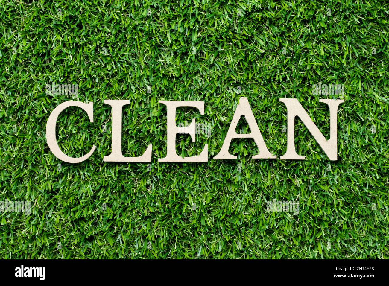 Wood alphabet letter in word clean on green grass background Stock ...