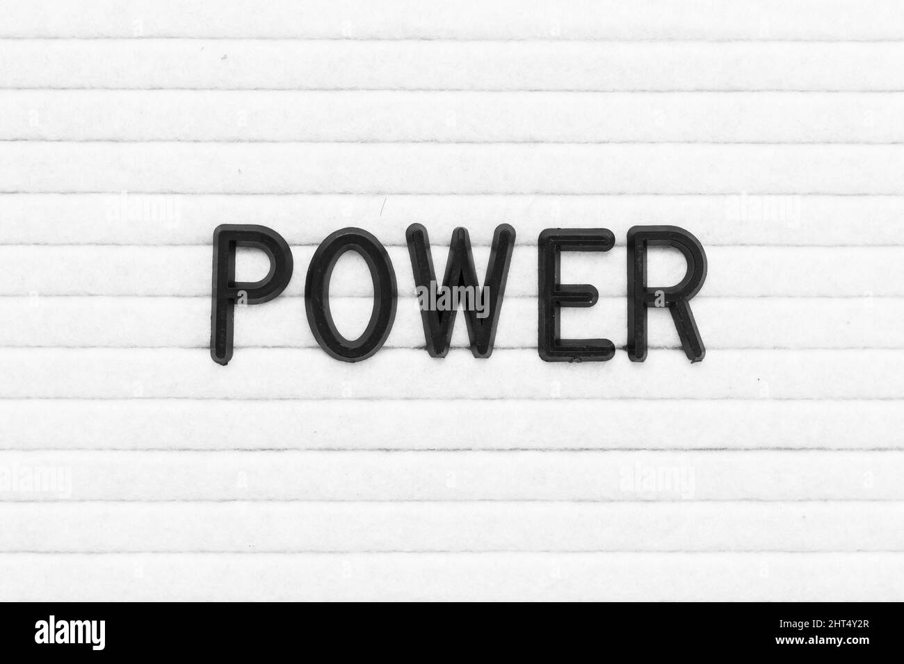 Black color letter in word power on white felt board background Stock ...