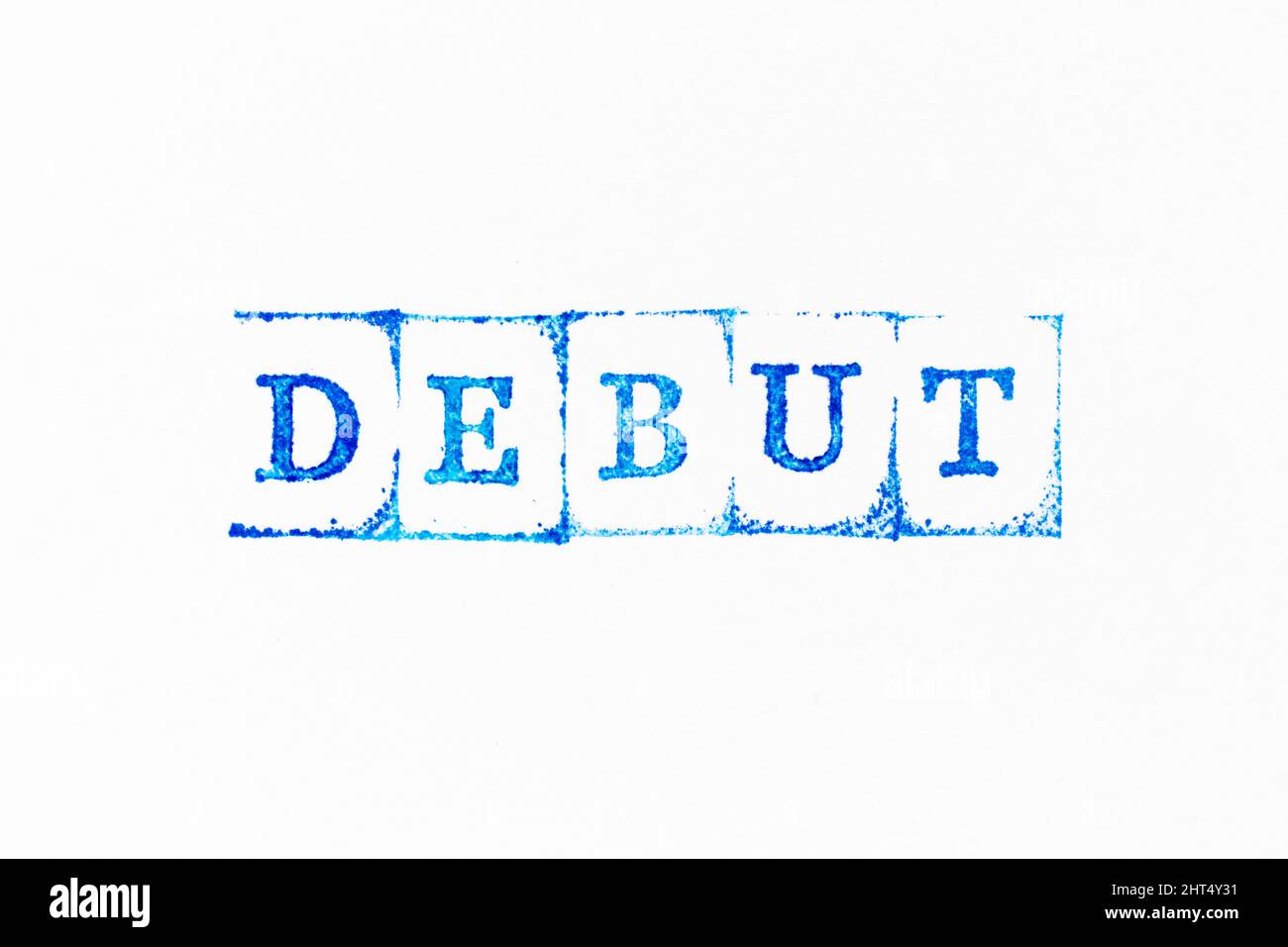 Blue color ink rubber stamp in word debut on white paper background ...