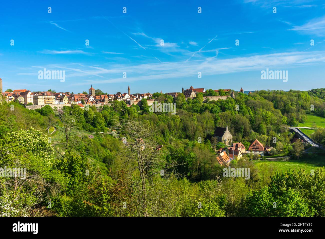 Aerial beautiful landscape view of green grass fields, houses mountains ...