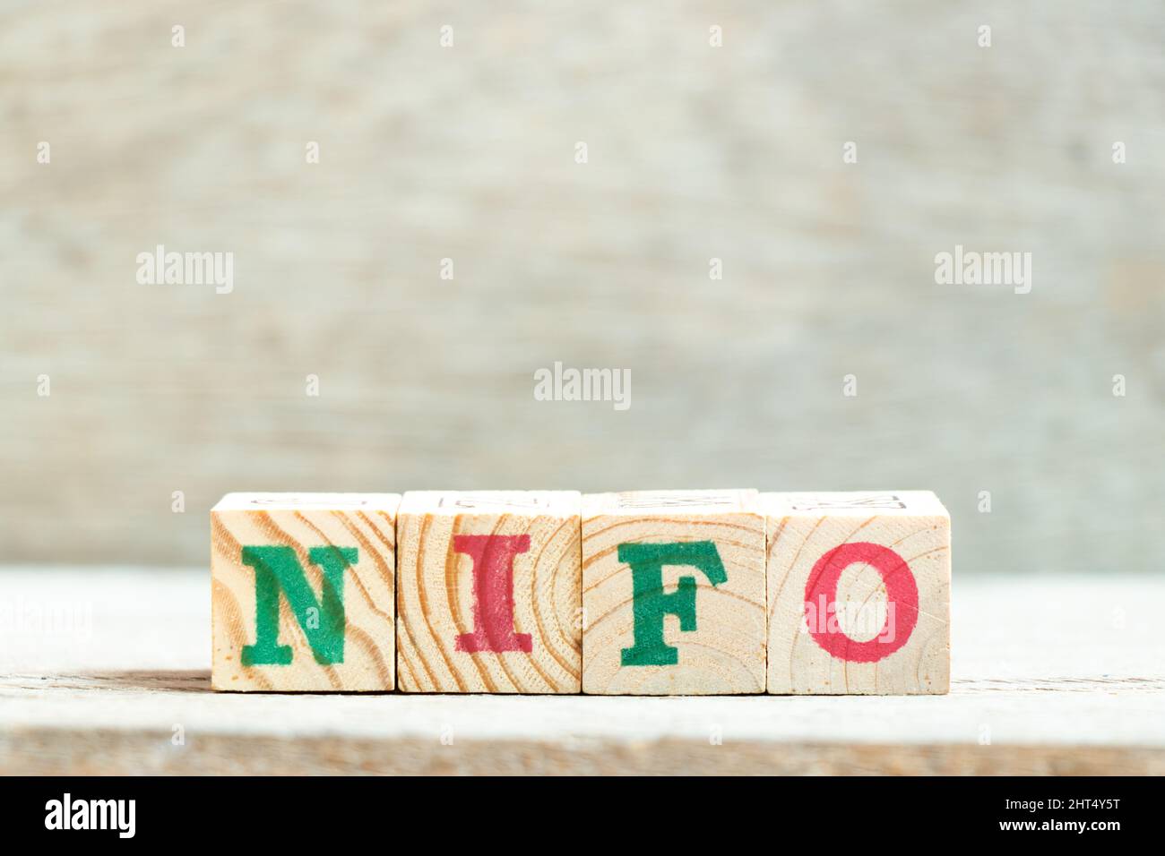 Alphabet letter block in word NIFO (Next in first out)on wood ...