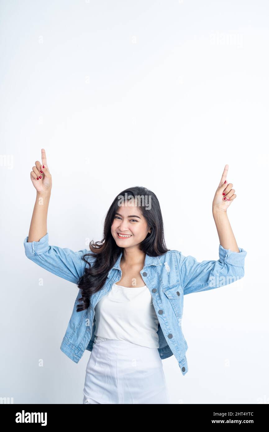 young woman with two finger pointing up Stock Photo - Alamy