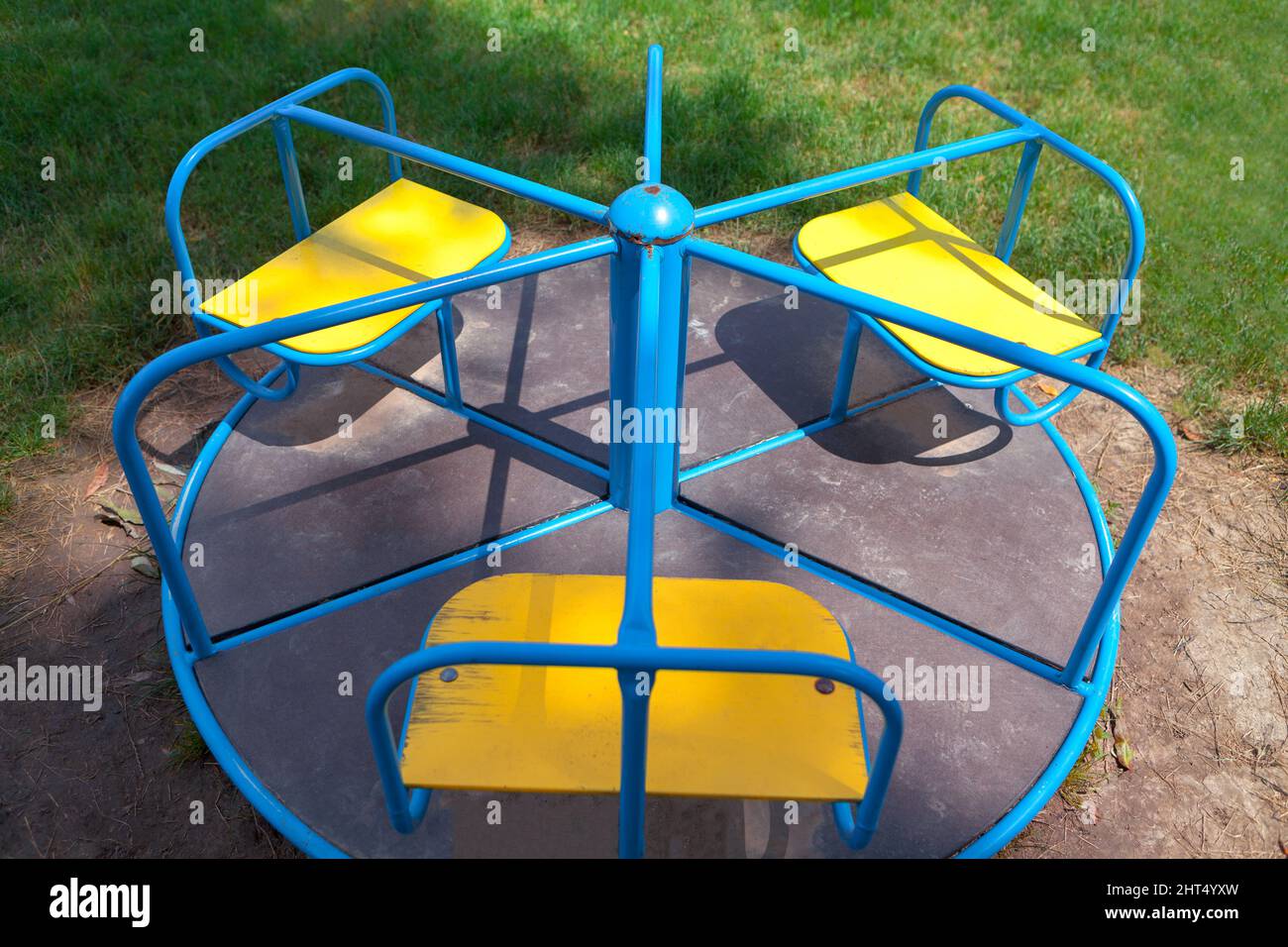 Rotating swing in the playground Stock Photo - Alamy