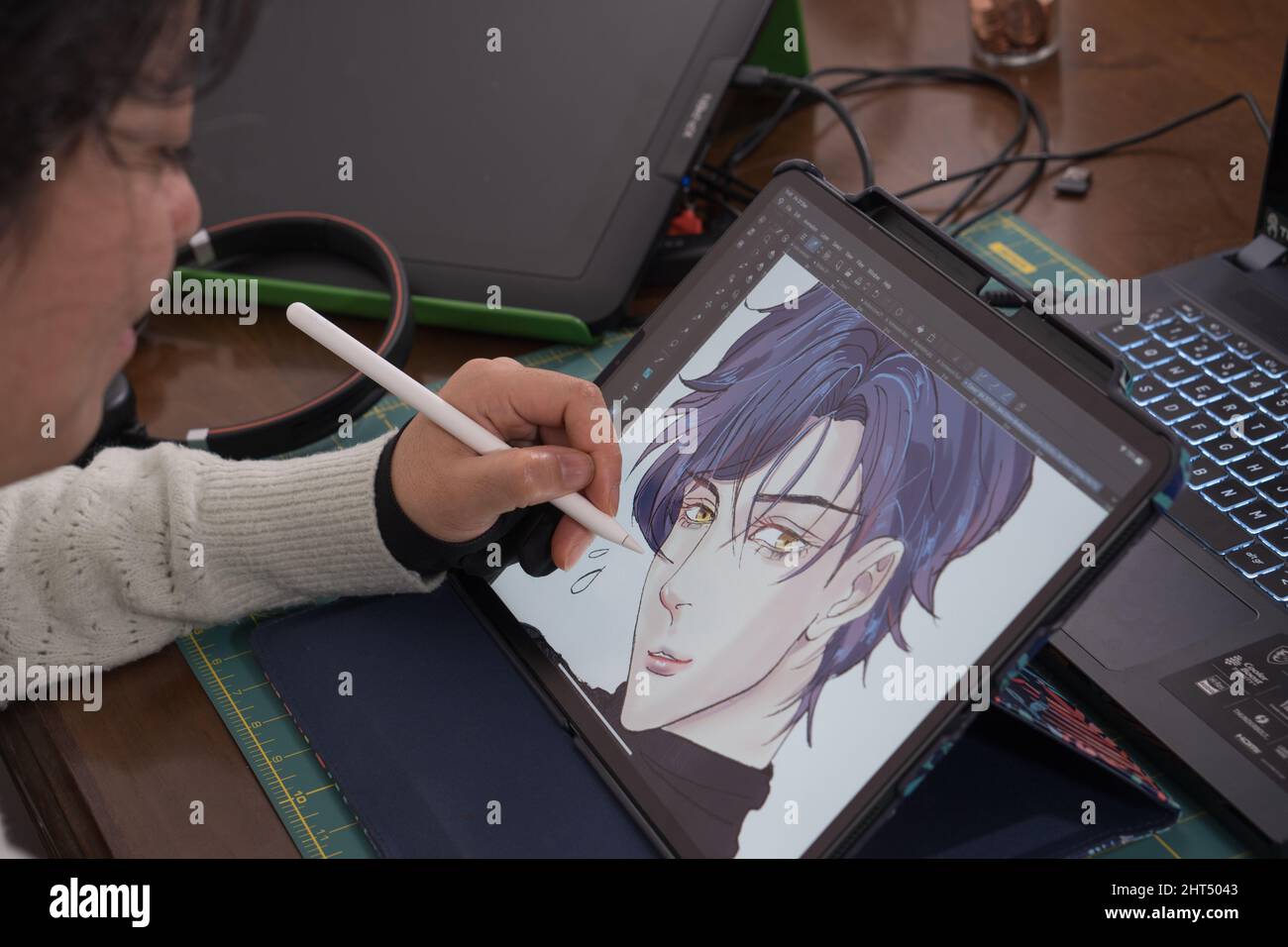 Digital artist drawing with a tablet Stock Photo - Alamy