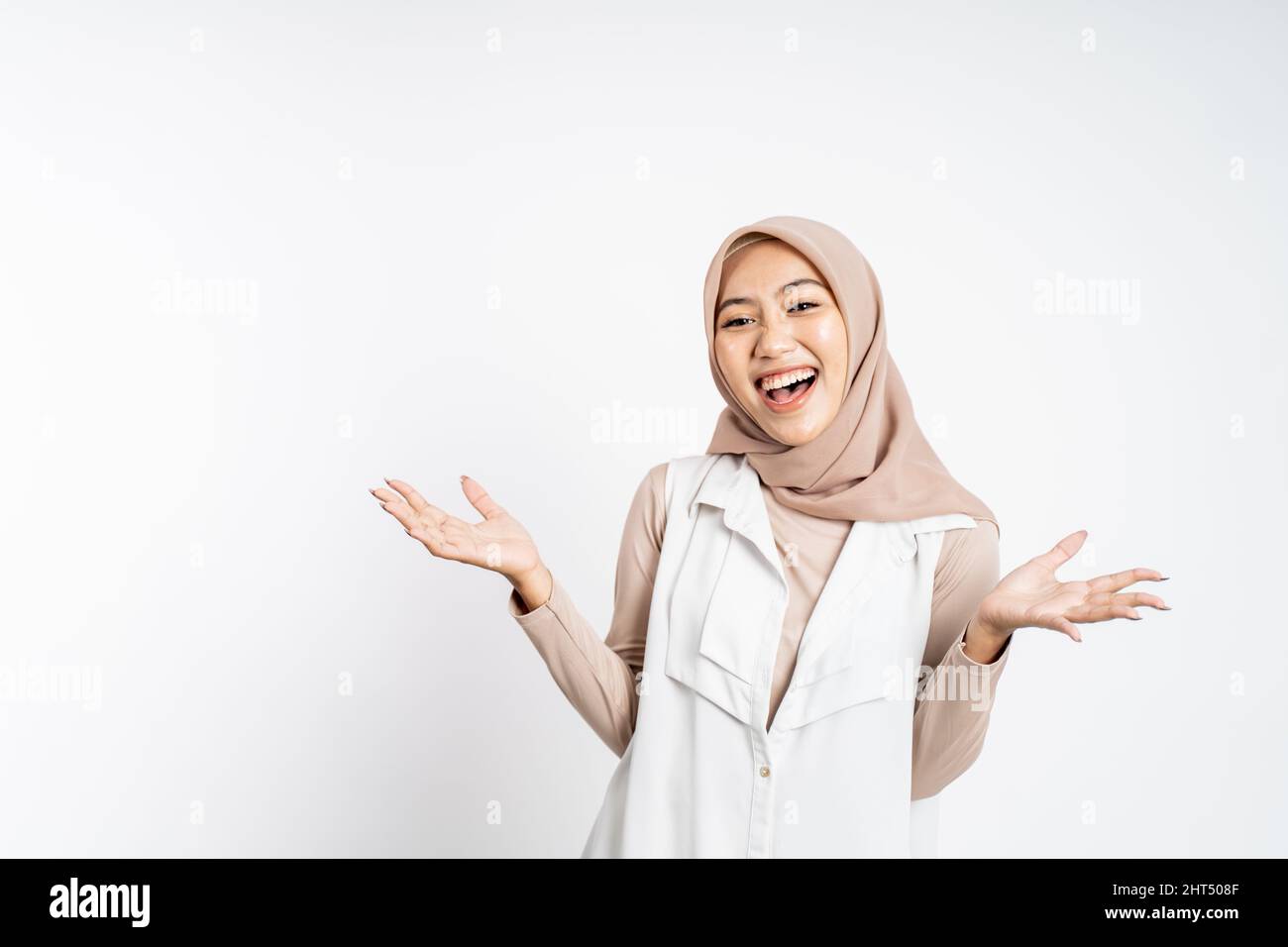 woman in hijab clenching hands while celebrating success Stock Photo ...