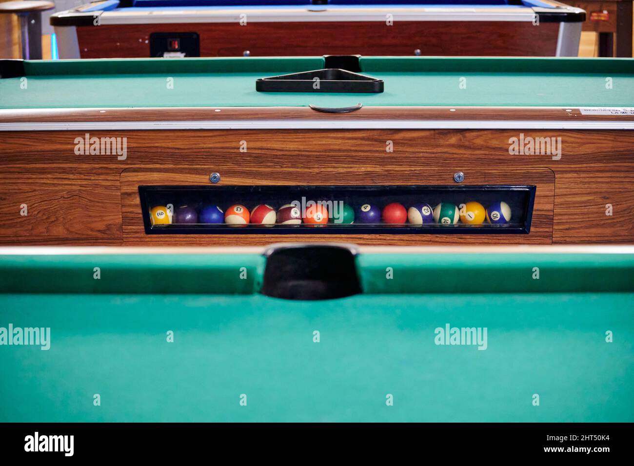 Set of pool balls on the return rack of a pool table Stock Photo - Alamy