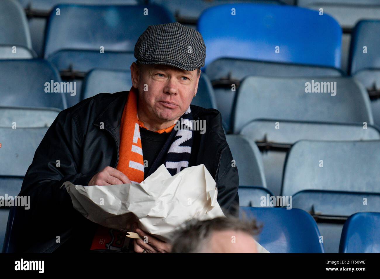 Luton fan enjoying some fish and chips before the game Stock Photo - Alamy