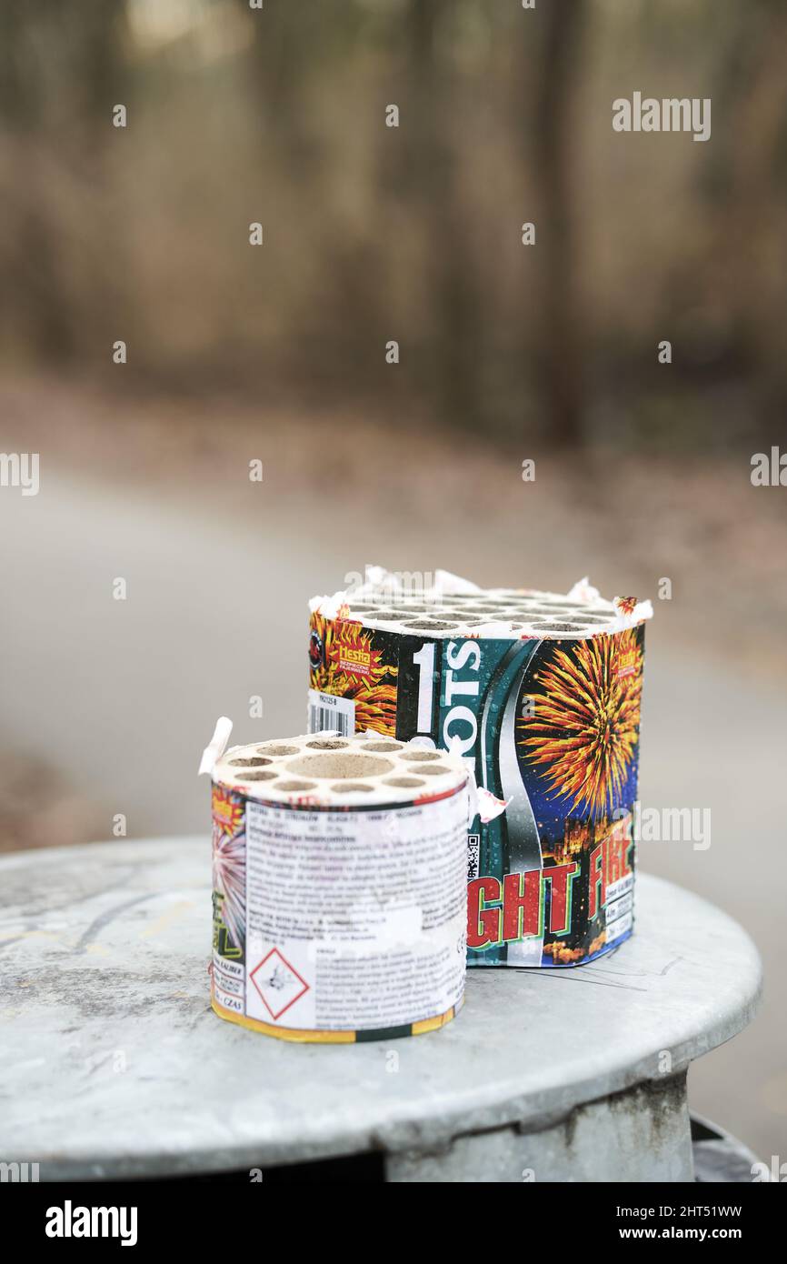 Vertical shot of fireworks waste standing on a wall at a park just ...