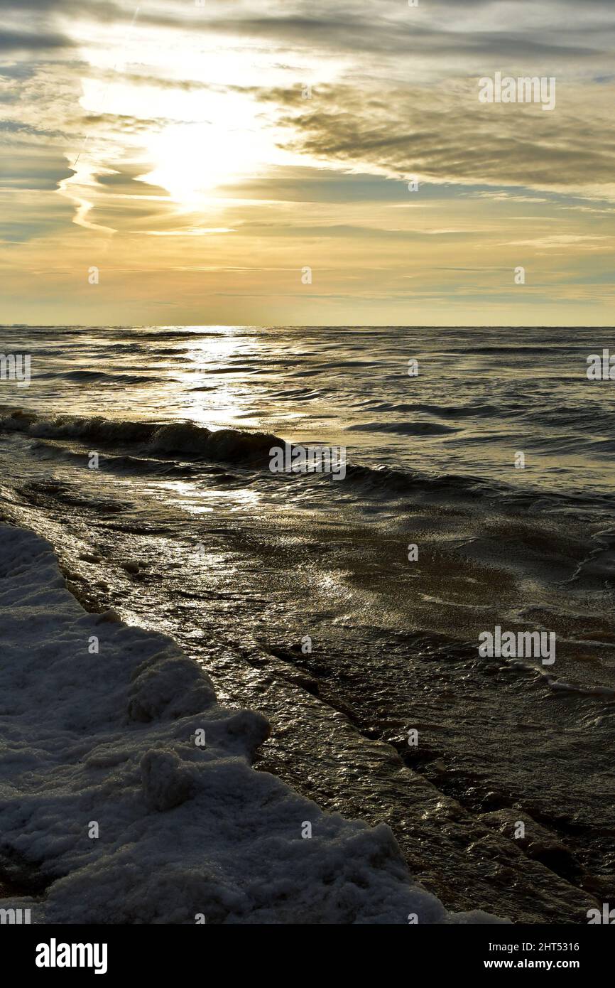 Beautiful landscape of a sandy beach with ice drifts Stock Photo - Alamy