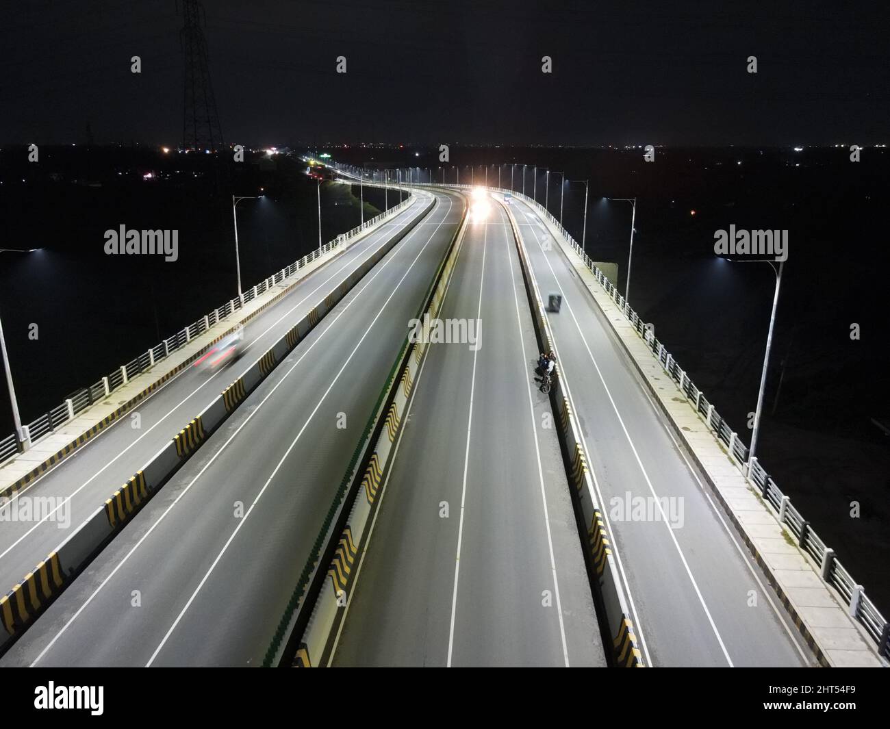 View of the long curved bridge at late night Stock Photo - Alamy
