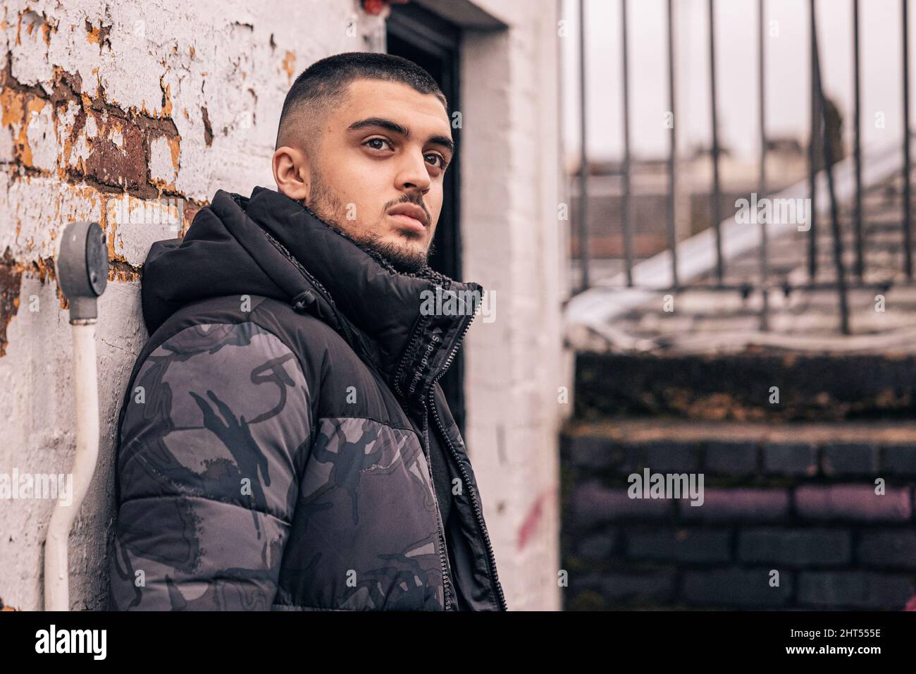 Cool stylish Pakistani male posing in a street Stock Photo - Alamy