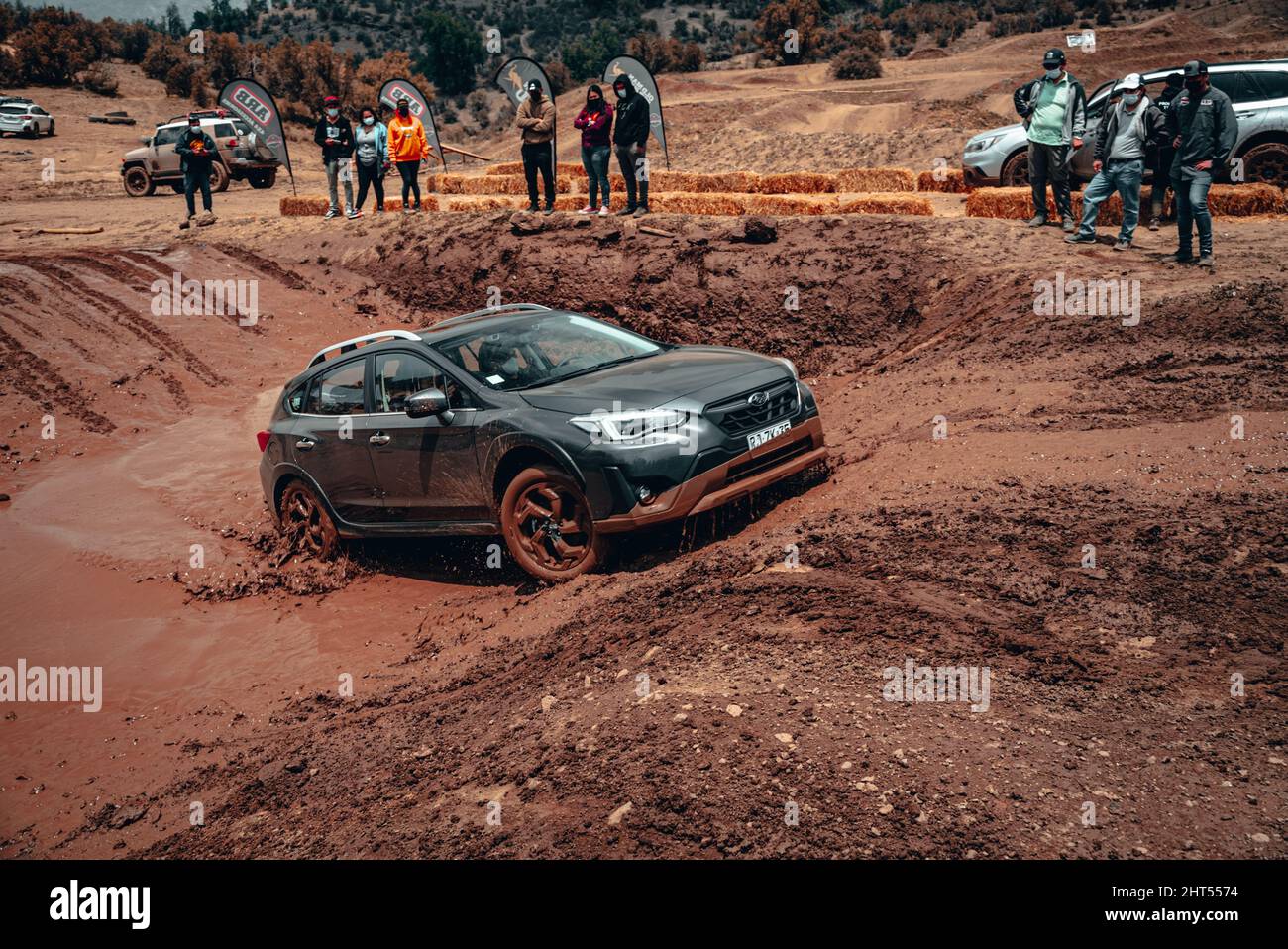 Offroad vehicle passing obstacles on the ground on an offroad course ...