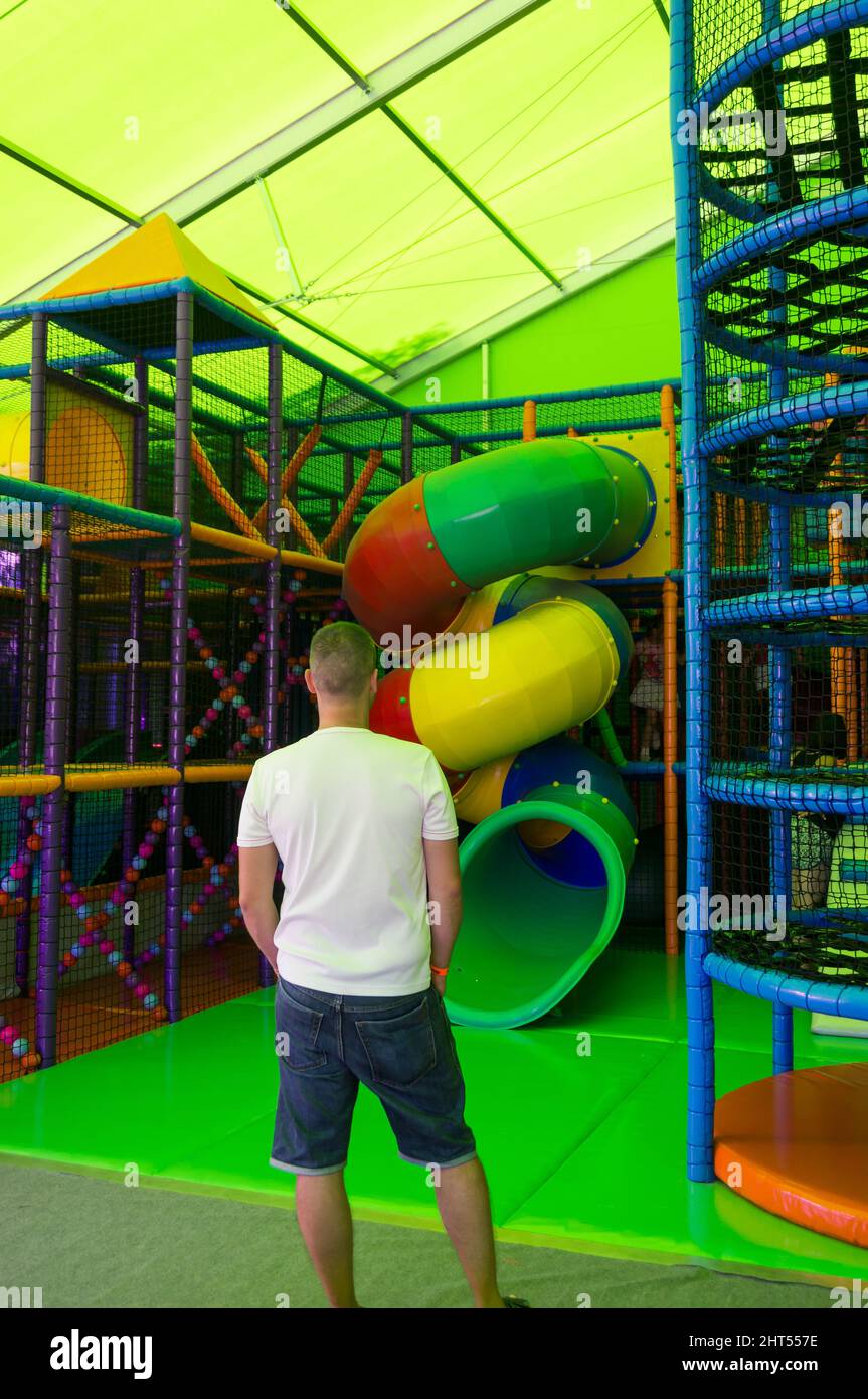 Man watching kids play hi-res stock photography and images - Alamy
