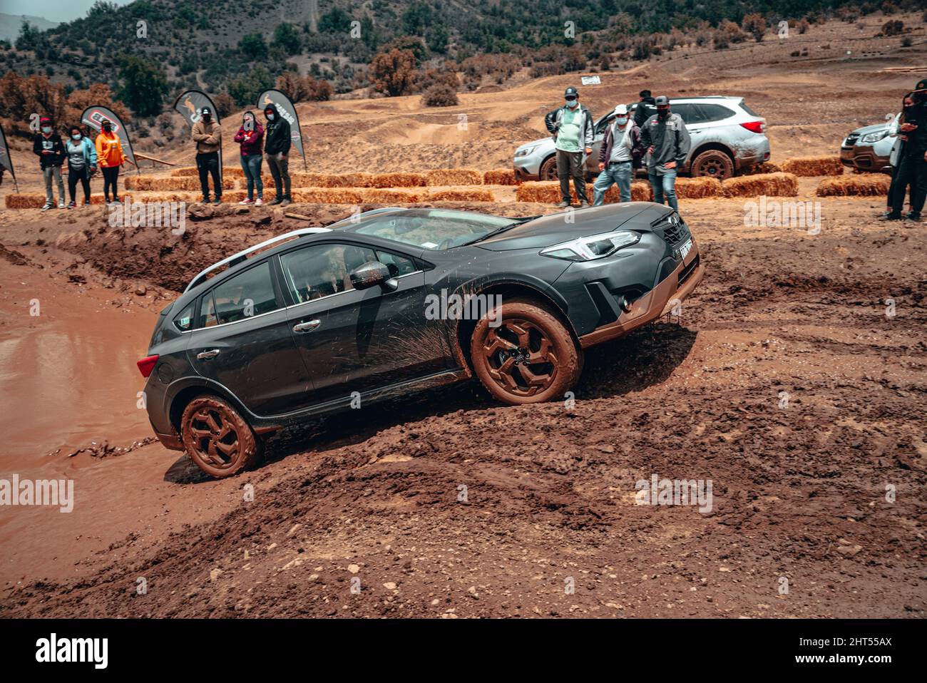 Offroad vehicle passing obstacles on the ground on an offroad course ...