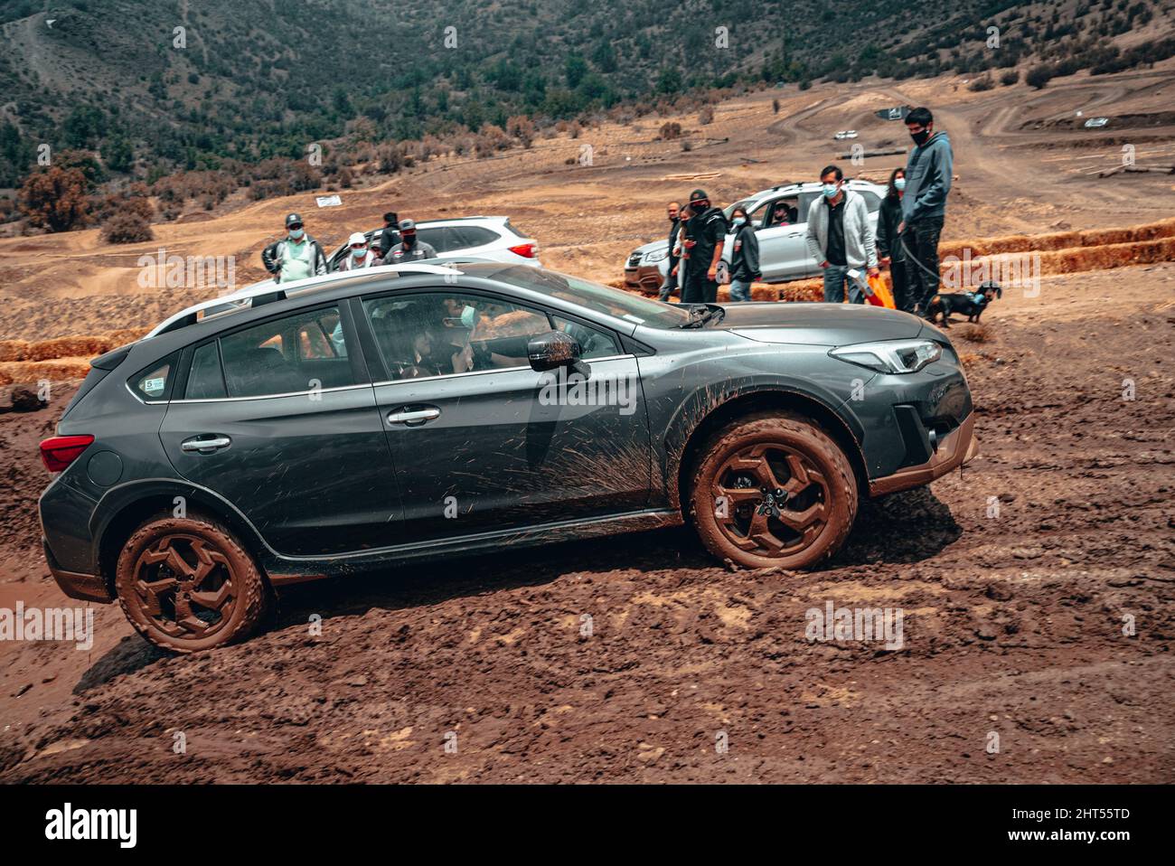 Offroad vehicle passing obstacles on the ground on an offroad course ...