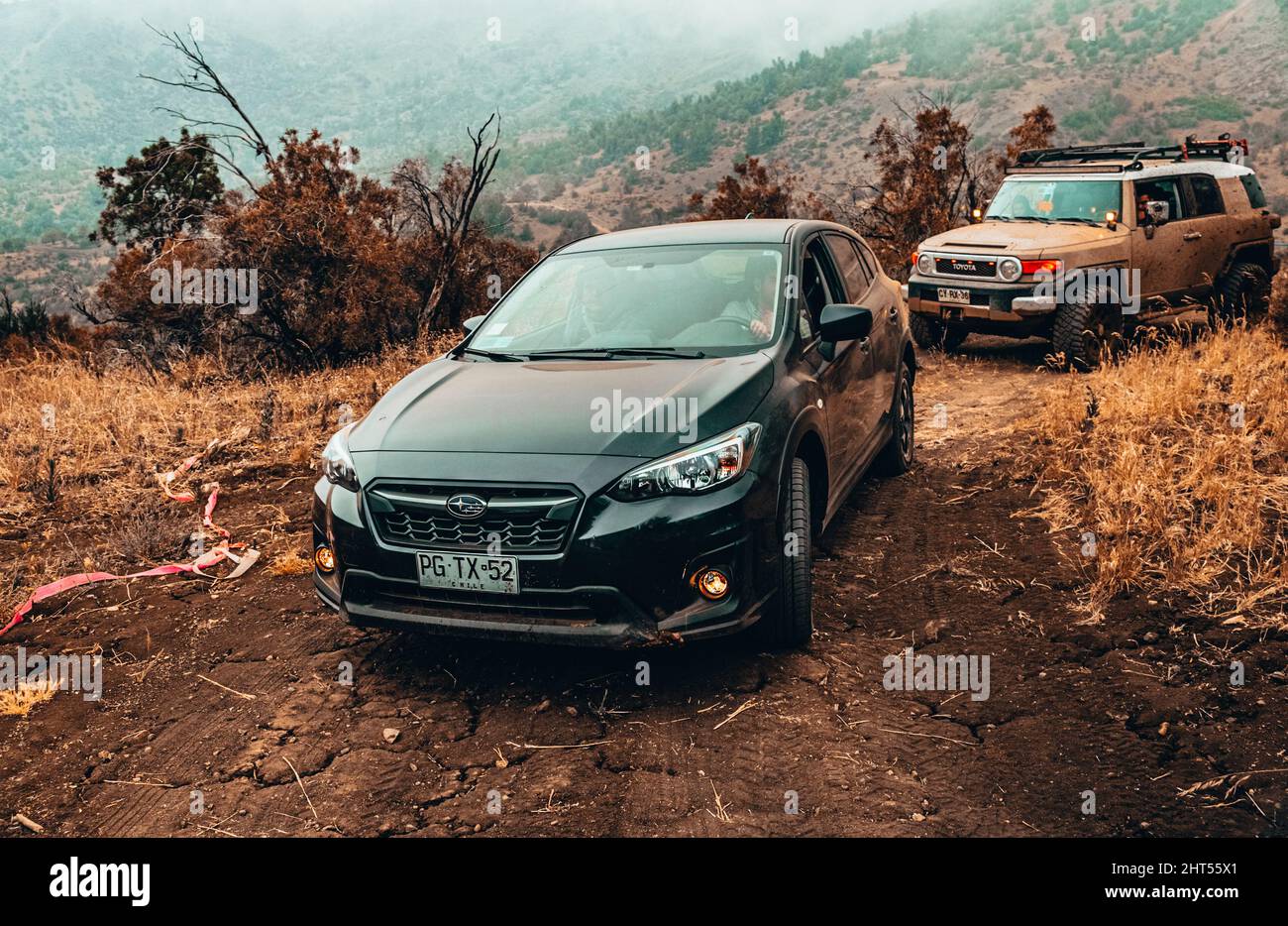 Offroad Subaru vehicle passing obstacles on the ground on an offroad ...