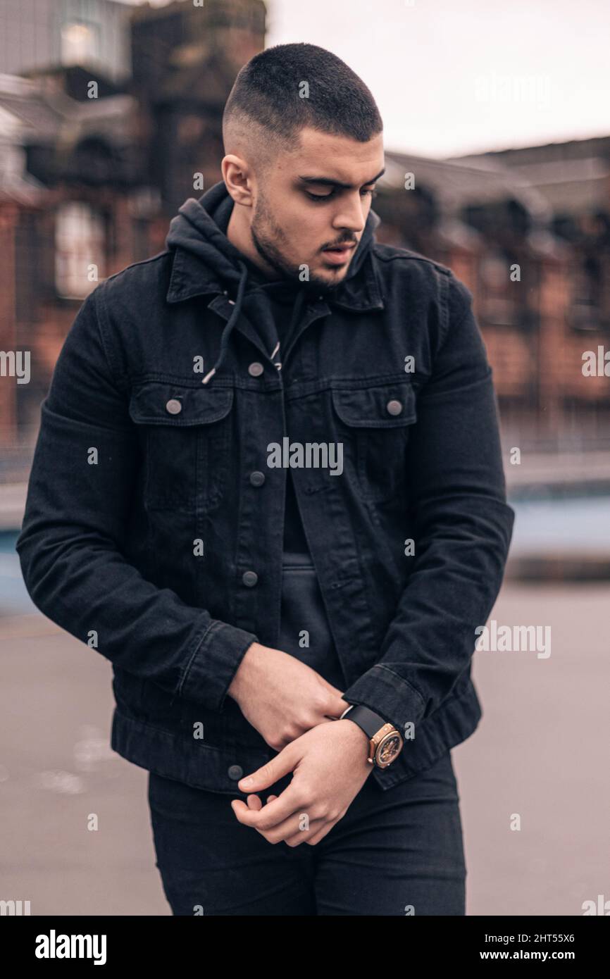 Vertical shot of a cool stylish Pakistani male posing in a street Stock ...
