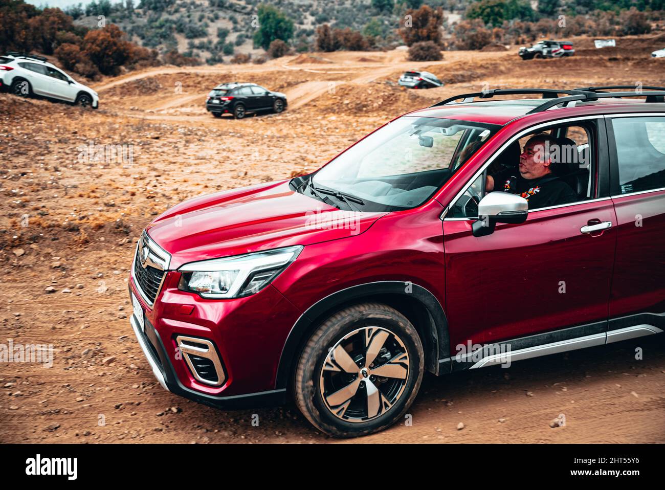 Offroad SUV vehicle passing obstacles on the ground on an offroad ...