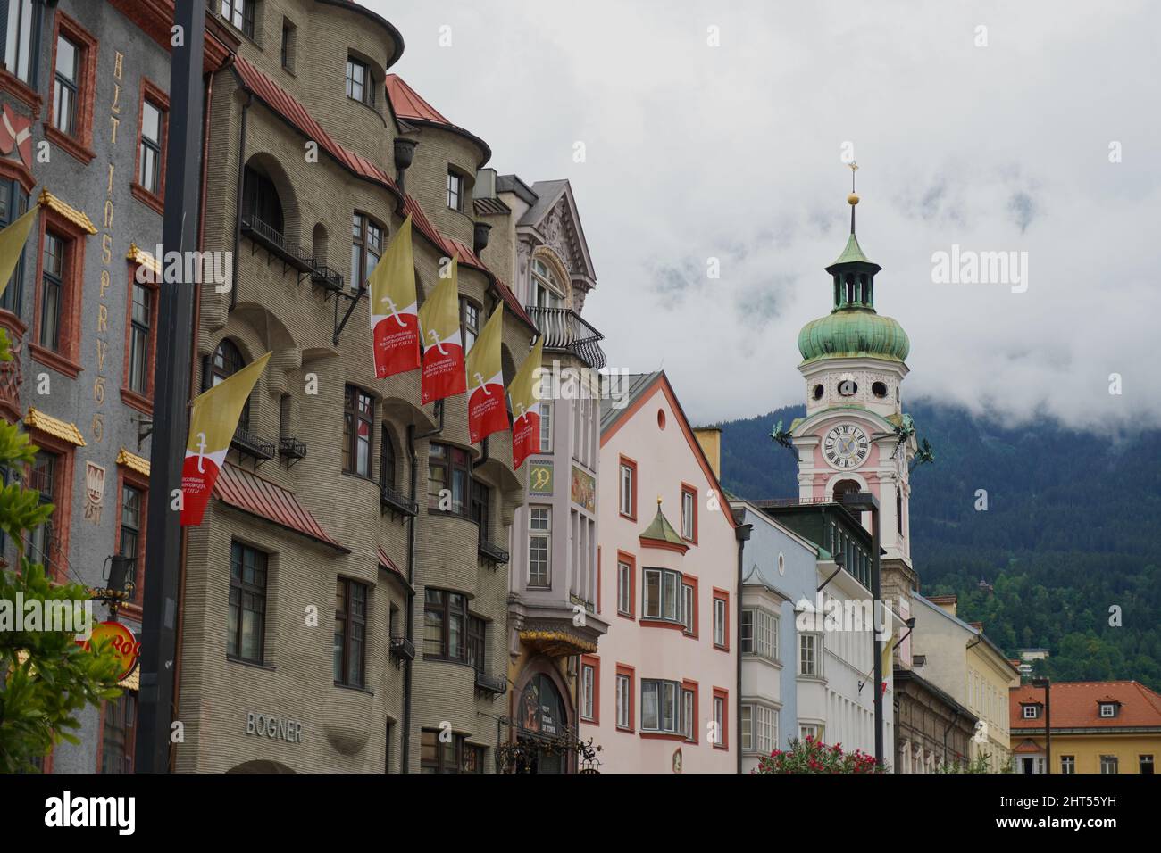 Beautiful view of a cityscape with clocktower in downtown Innsbruck ...