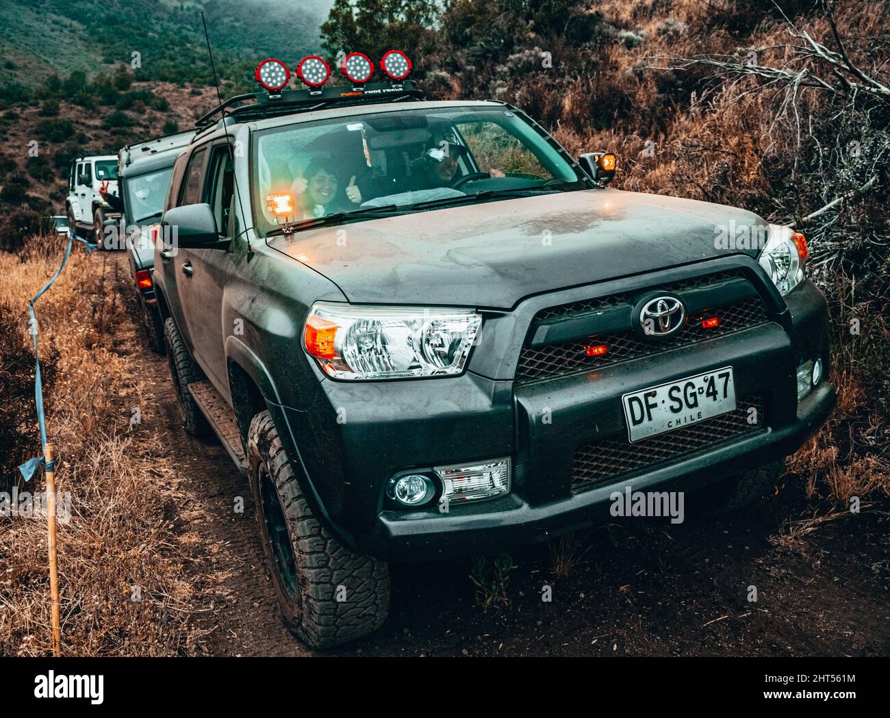 Offroad vehicle passing obstacles on the ground on an offroad course ...