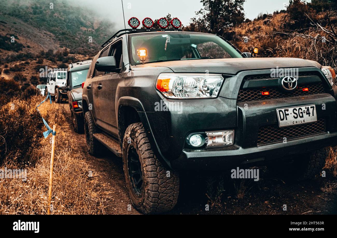 Offroad vehicle passing obstacles on the ground on an offroad course ...