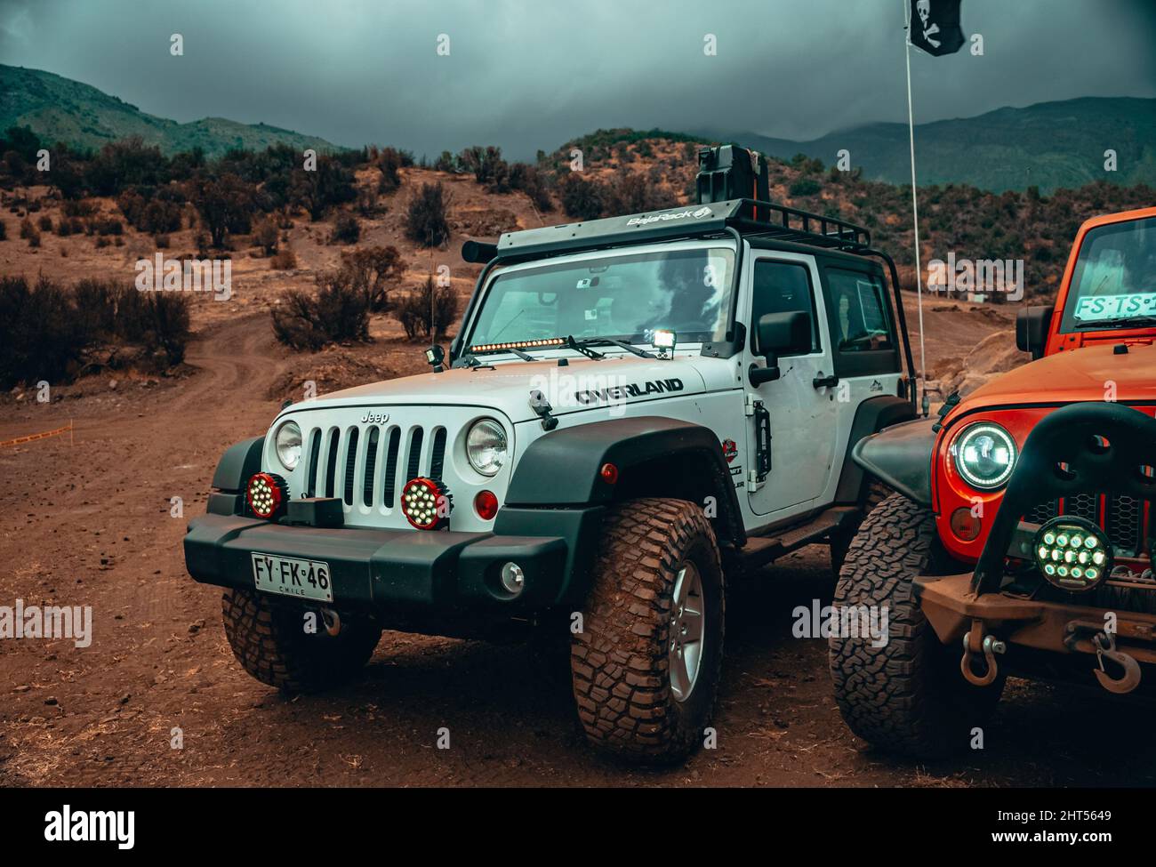 Offroad vehicle passing obstacles on the ground on an offroad course ...