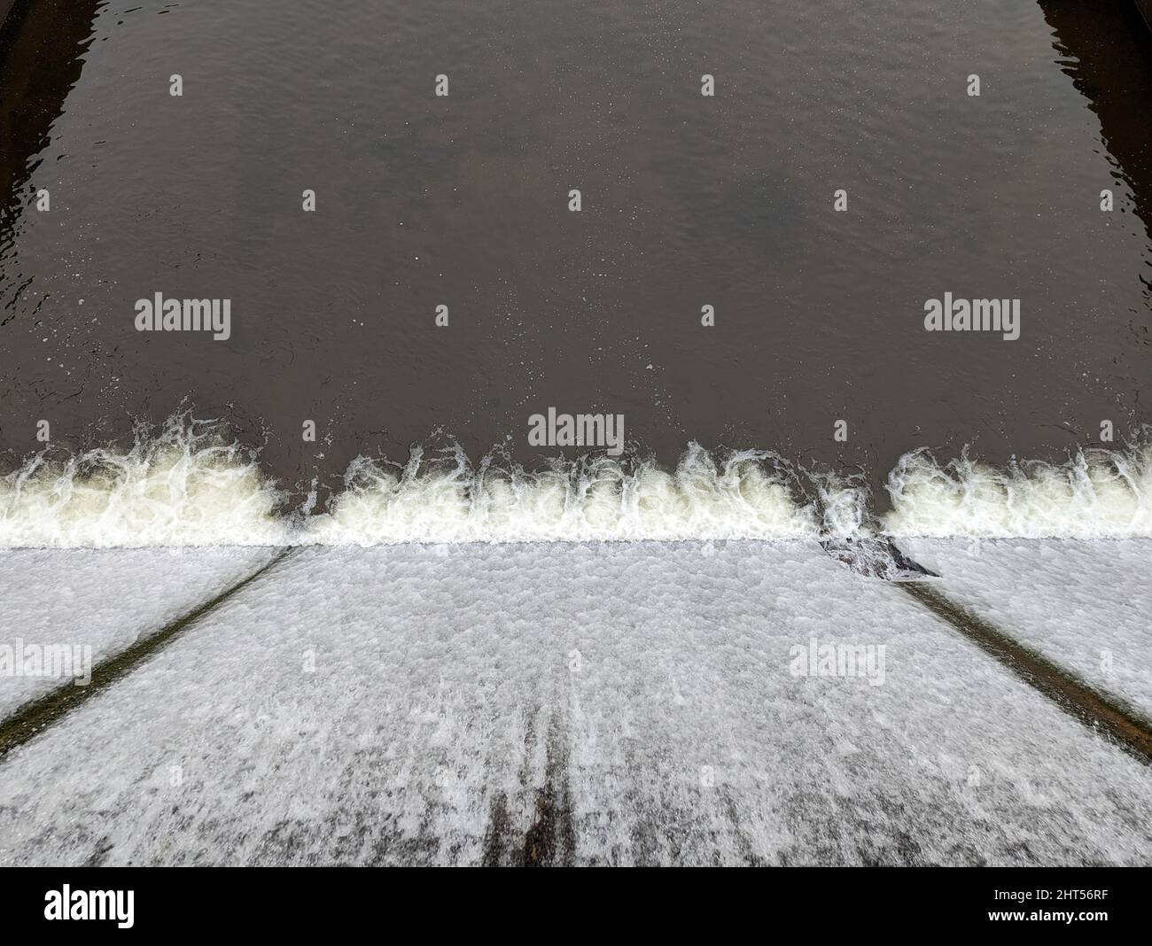 Closeup of water running down a hydro power plant Stock Photo - Alamy