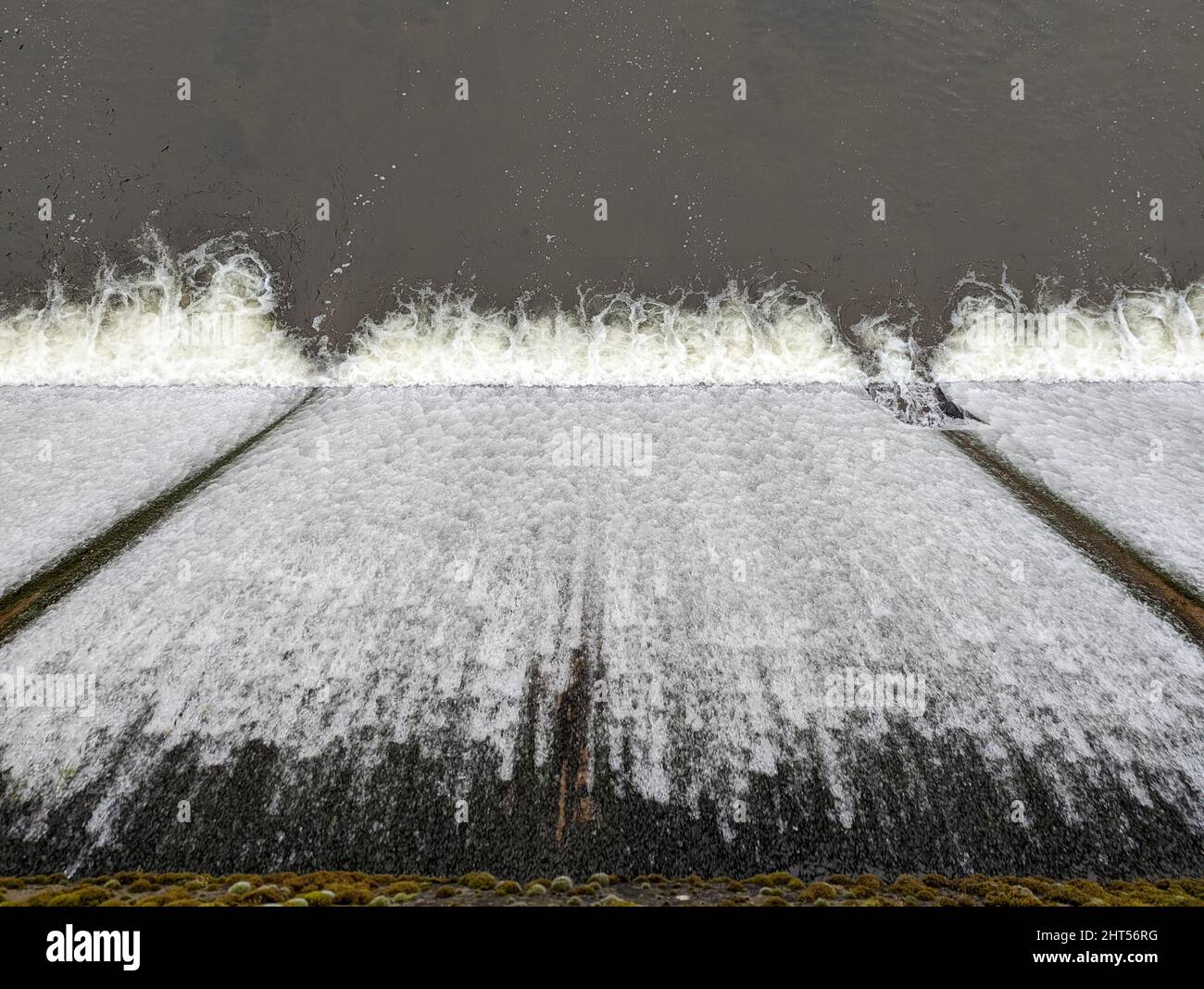 Closeup of water running down a hydro power plant Stock Photo - Alamy
