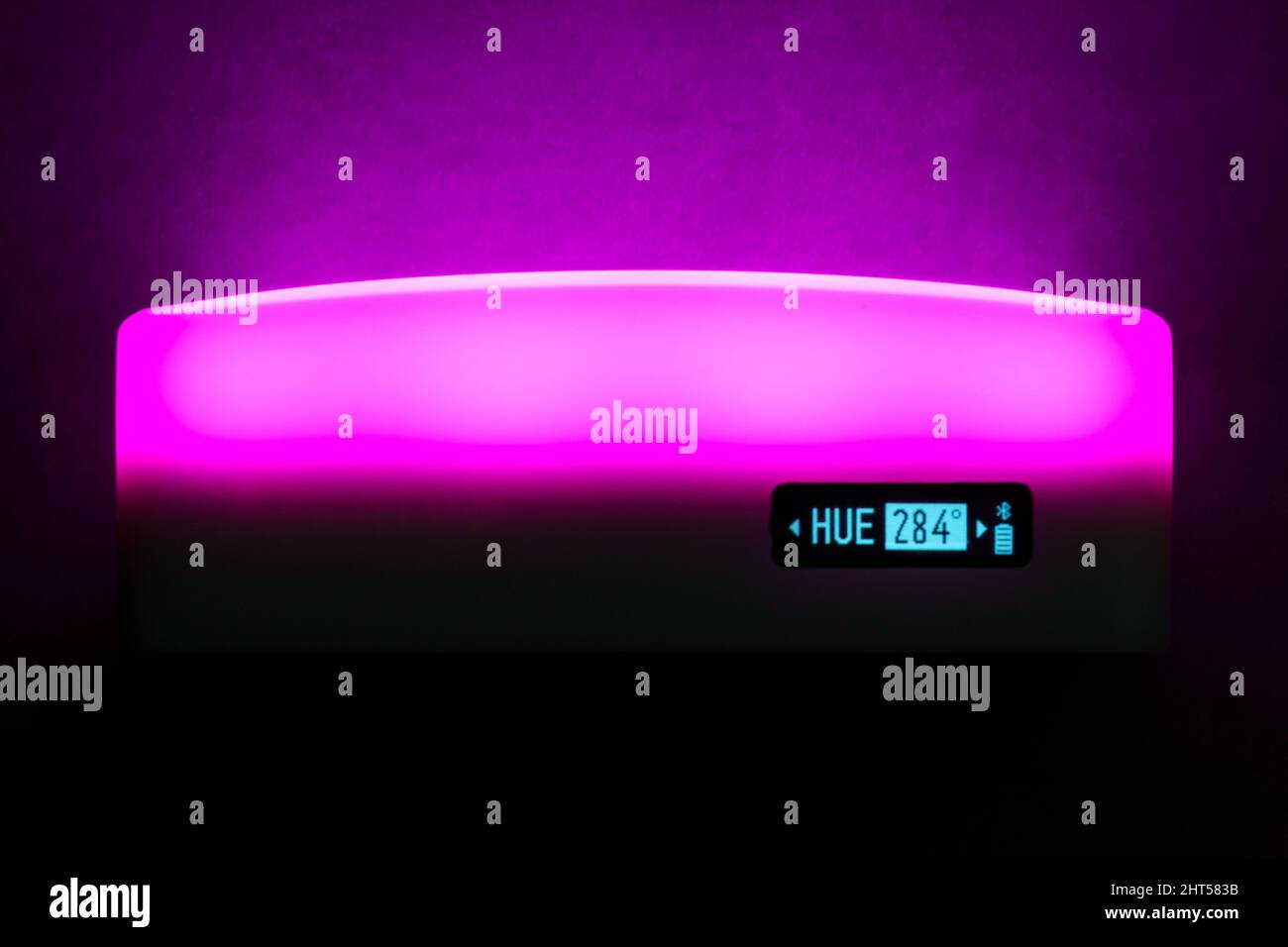 Hand holding a lighting color changing thermometer Stock Photo - Alamy