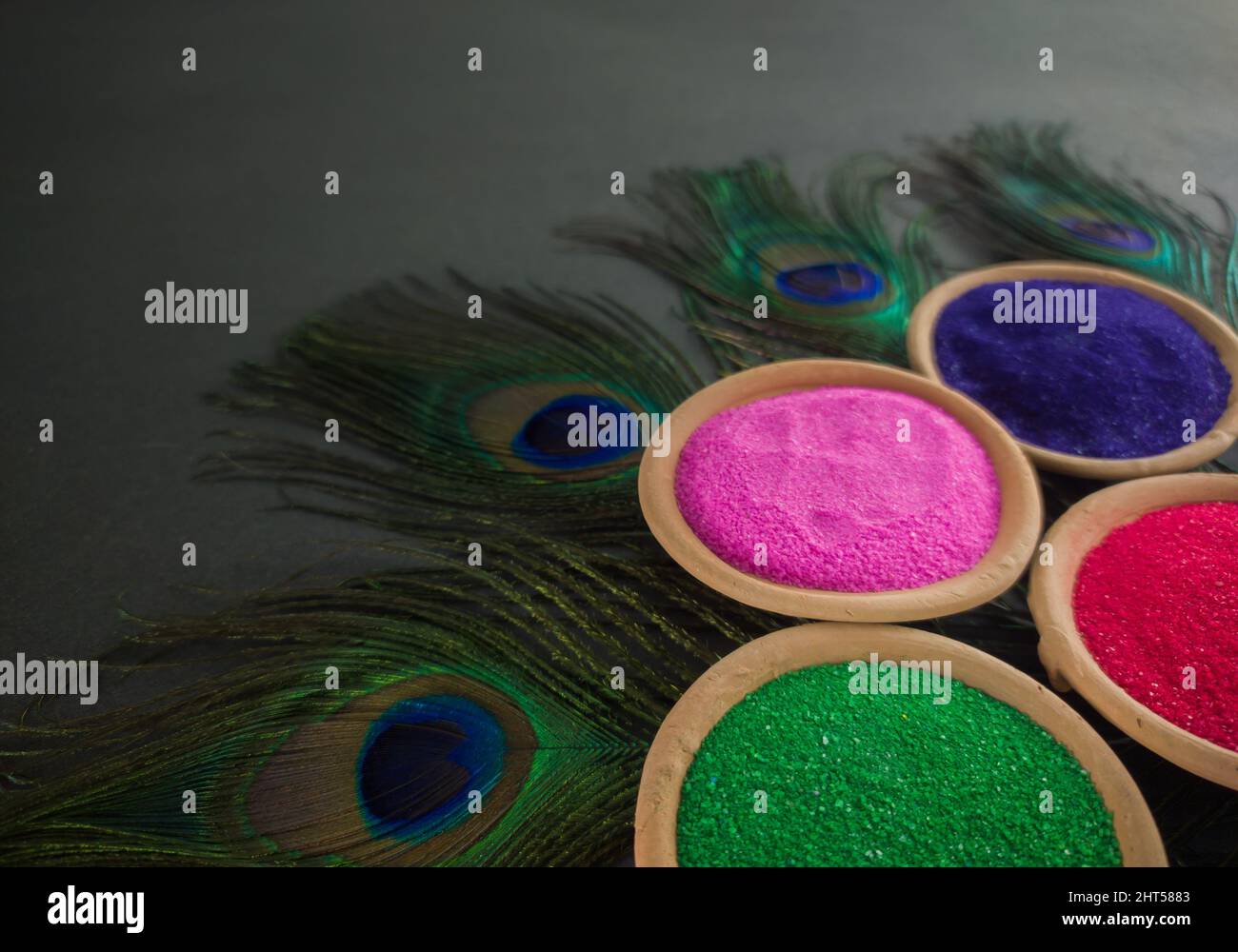 colorful powders for holi on clay pots on occasion of indian festival ...