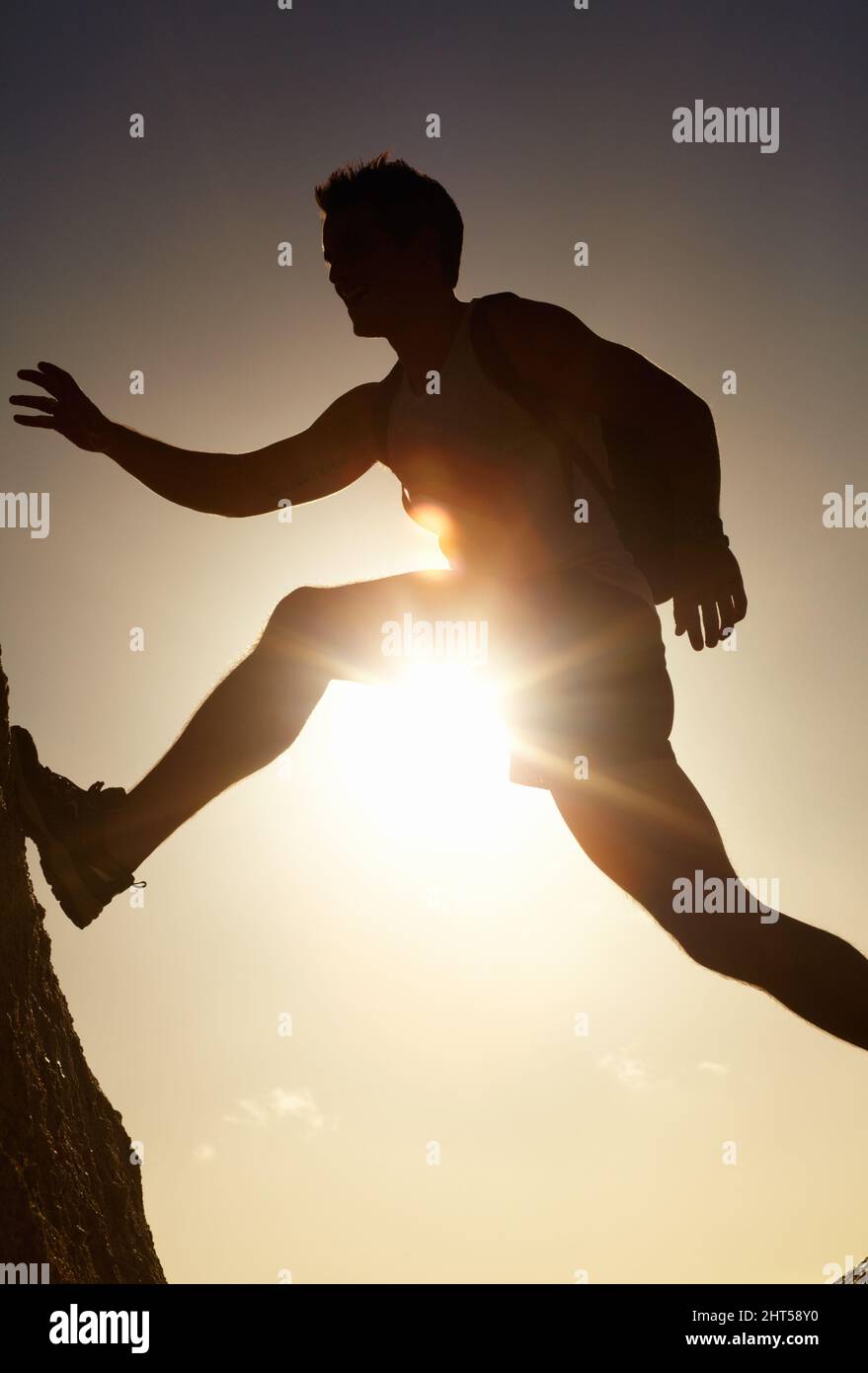 When adventure calls... answer. A silhouette of a man jumping over ...