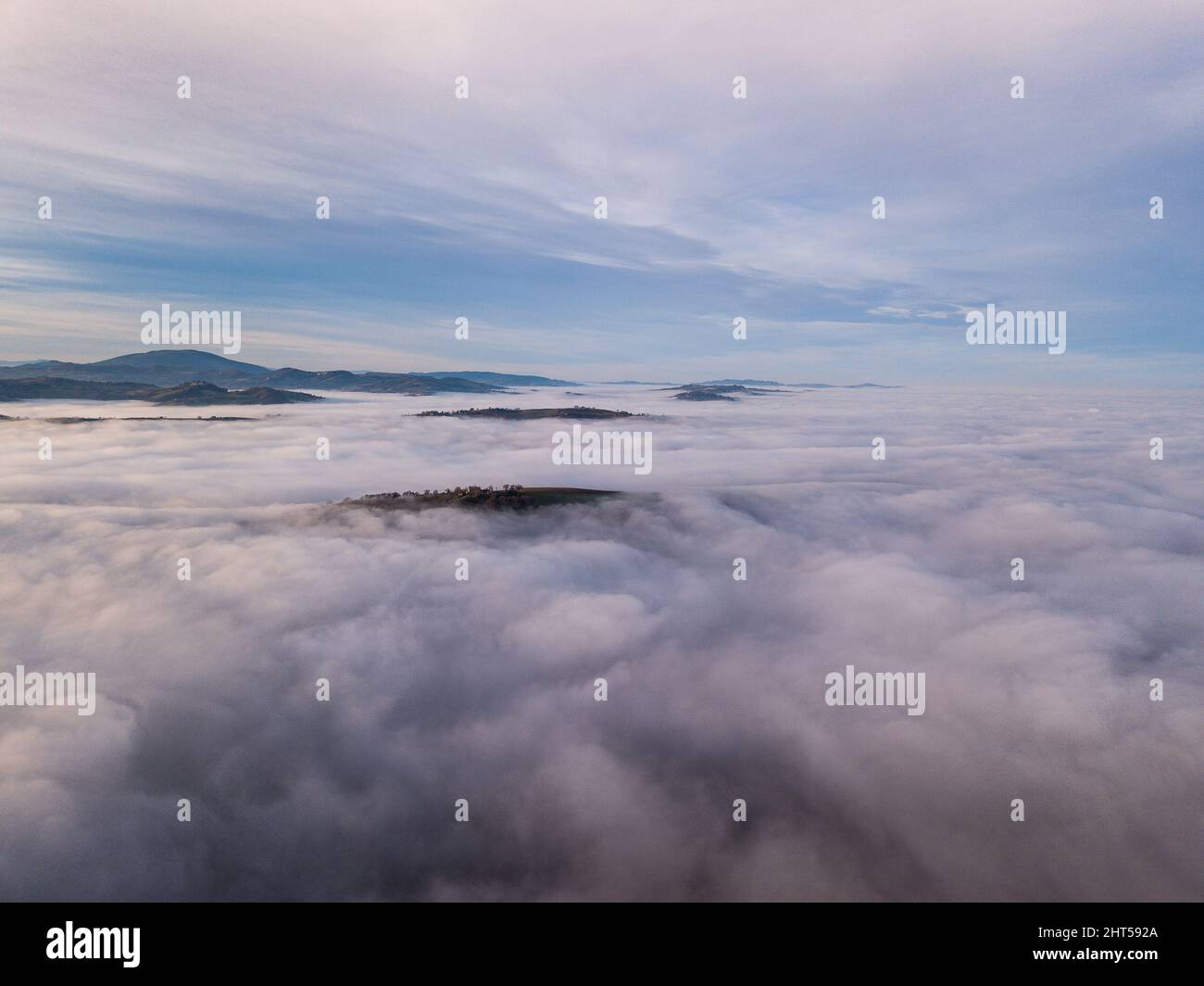 Aerial view of landscape surrounded by fog Stock Photo - Alamy