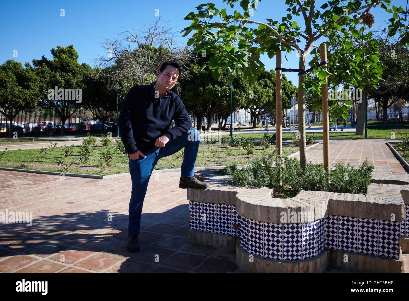 Closeup of a man leaning on a border Stock Photo - Alamy
