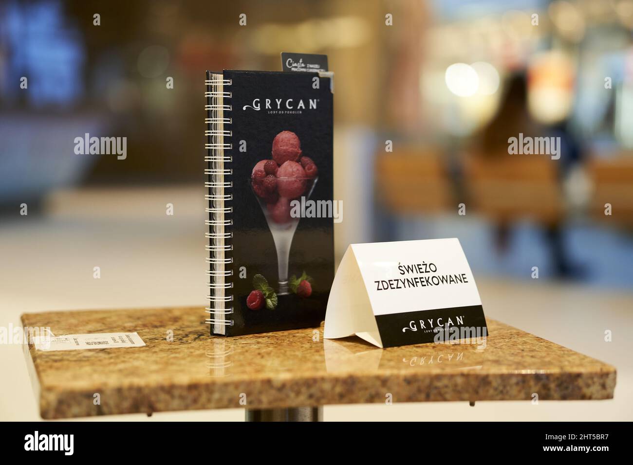 Menu and a card saying that the table is disinfected in a Grycan ice ...