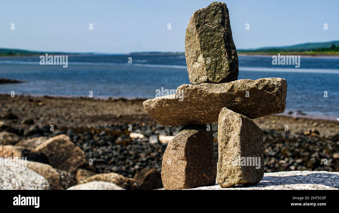 A close-up shot of balanced stones on a beach Stock Photo - Alamy