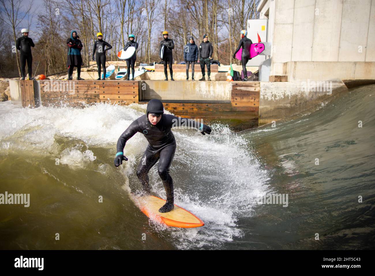 Nuremberg, Germany. 26th Feb, 2022. A surfer rides a surfboard on the ...