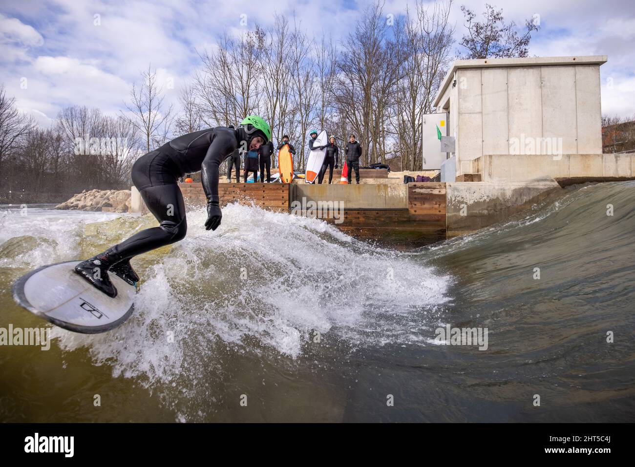 Nuremberg, Germany. 26th Feb, 2022. A surfer rides a surfboard on the ...