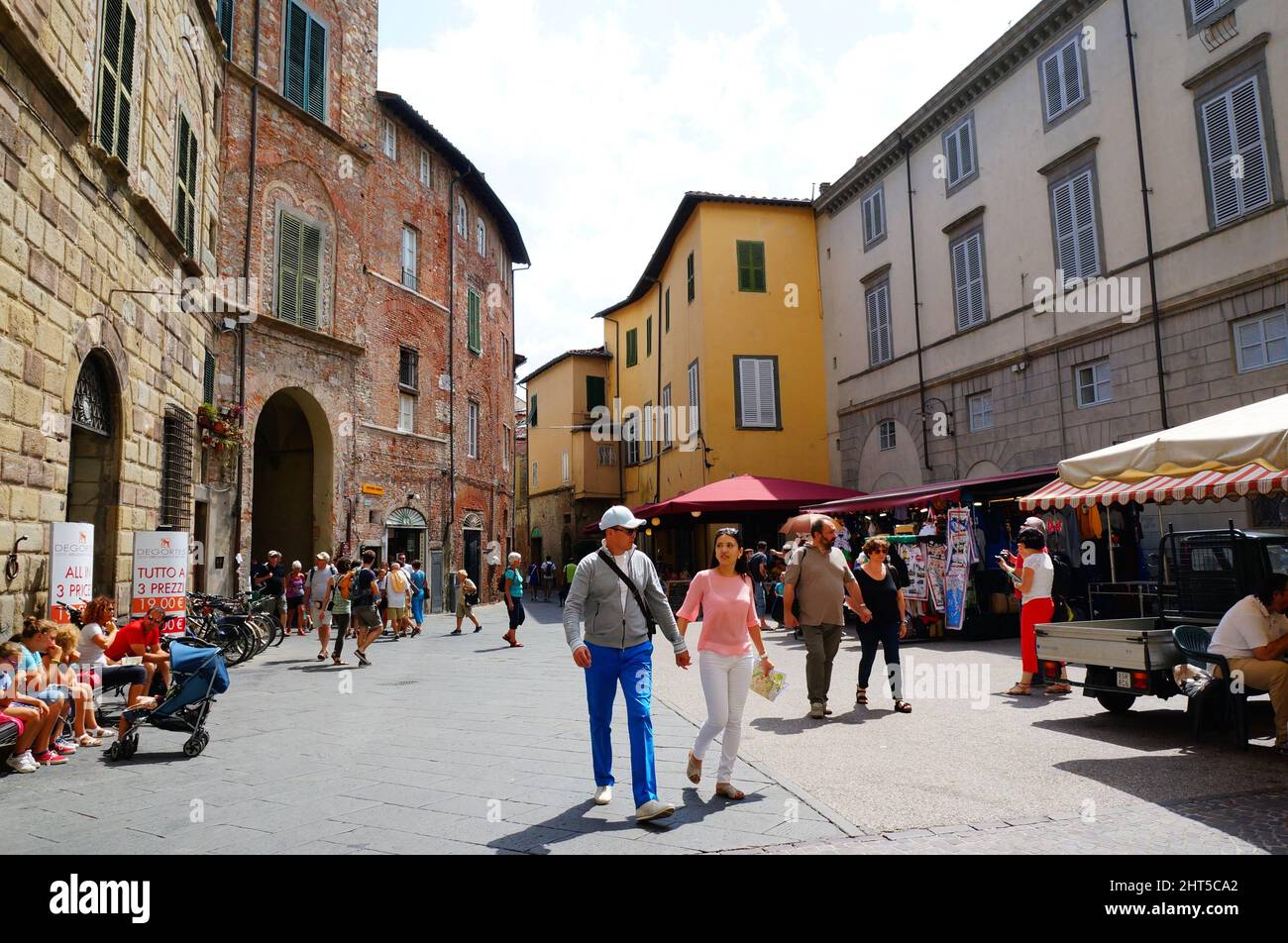 Group of people walking through the street in Italy, Lucca Stock Photo ...