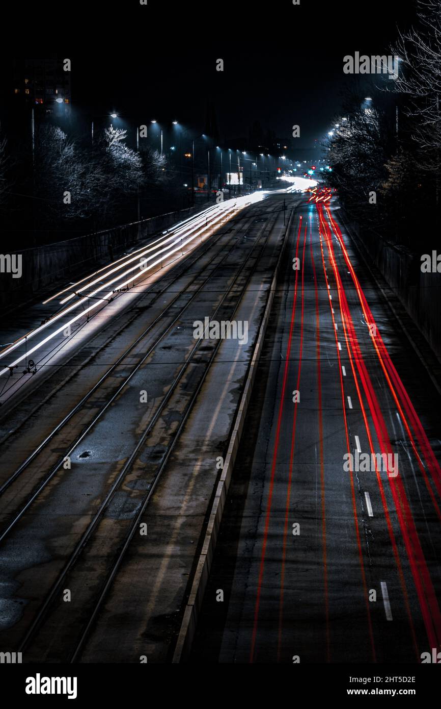 Vertical night photo from high bridge showing red lights of cars Stock ...