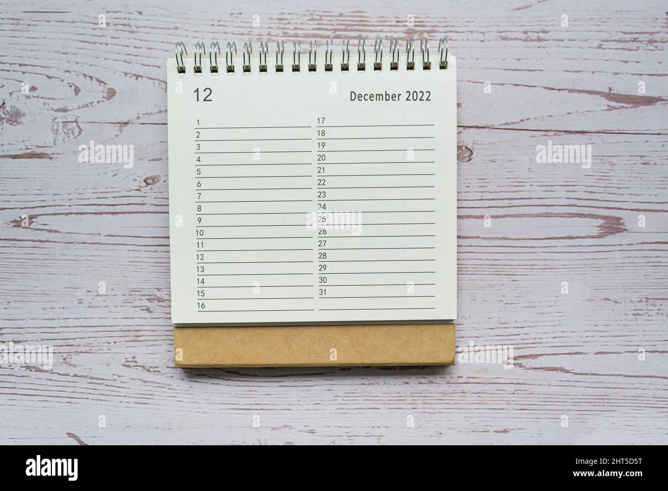 December planner and organizer 2022 calendar on wooden desk. Directly ...